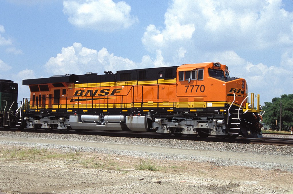 BNSF 7770, GE ES44DC (GEVO), is eastbound departing the BNSF Yard